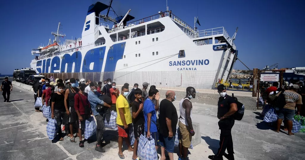 Two dead as hundreds of boat migrants arrive on Italy's Lampedusa ...